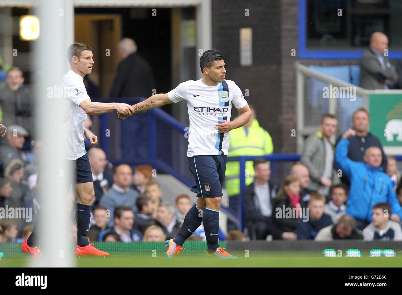 Manchester Citys Sergio Aguero Right Celebrates Scoring Their First