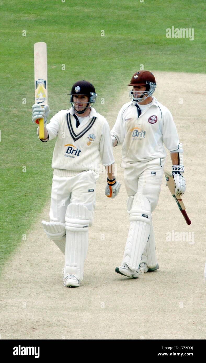 Surrey batsmen ally brown left jon batty celebrate century hi-res stock ...
