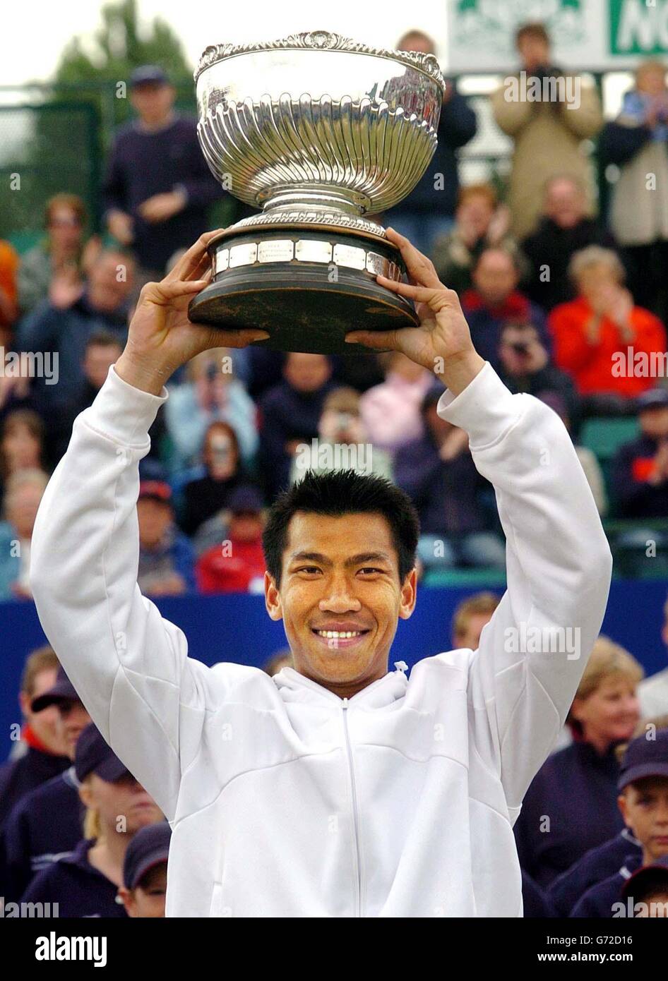 Thailand's Paradorn Srichaphan holds the trophy after winning the ...