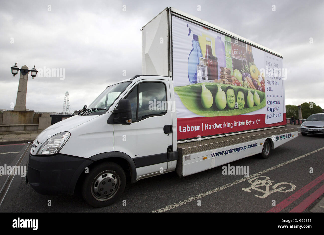 A Labour party campaign poster crosses Lambeth Bridge in front of the ...