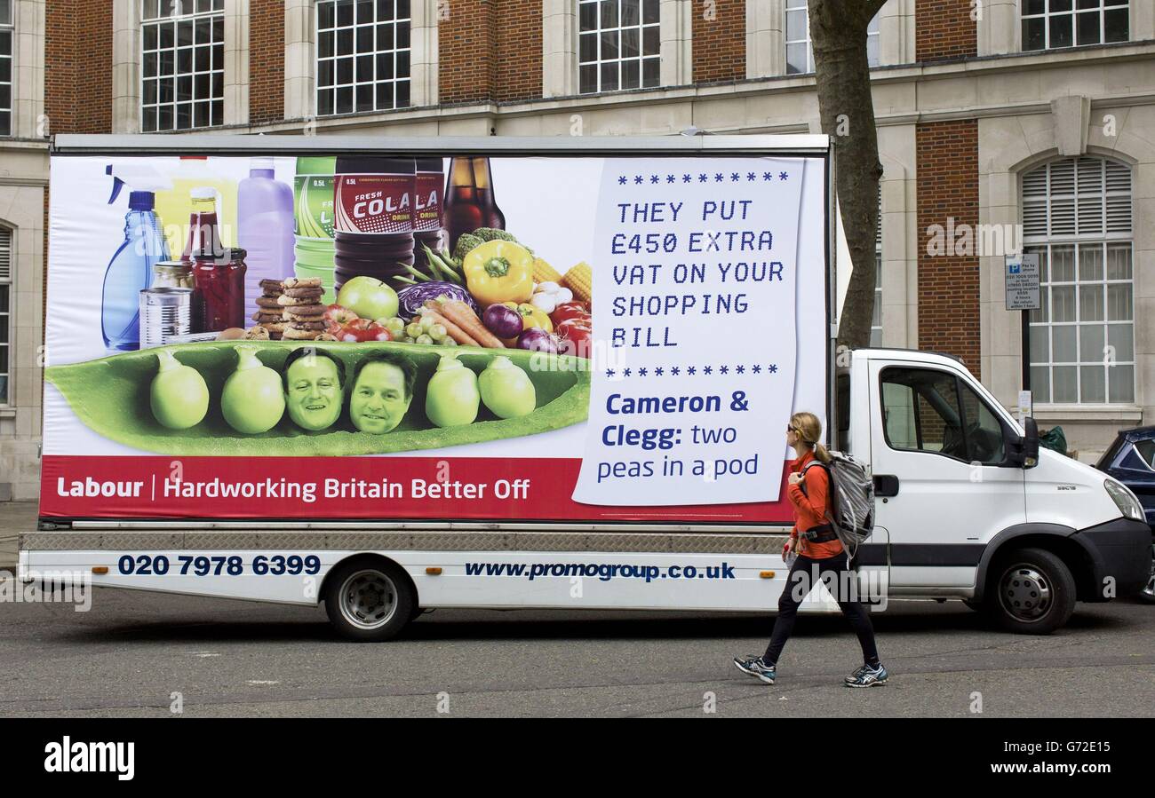 A woman walks past the launch of a Labour party campaign poster ahead ...