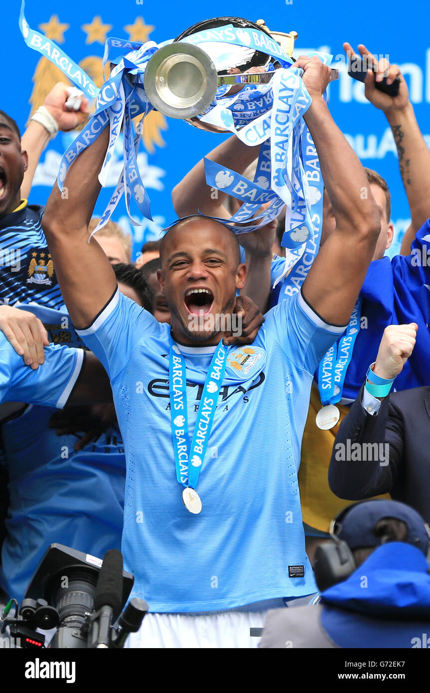 Manchester City's captain Vincent Kompany lifts the premier league ...
