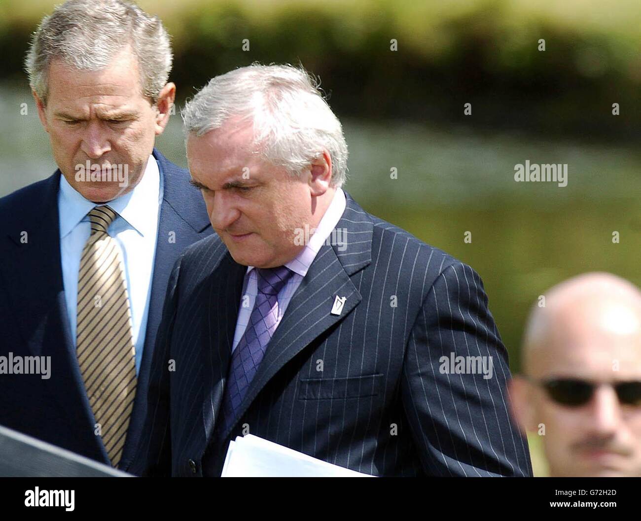 US President George Bush (left) and Irish Taoiseach Bertie Ahern pass a ...