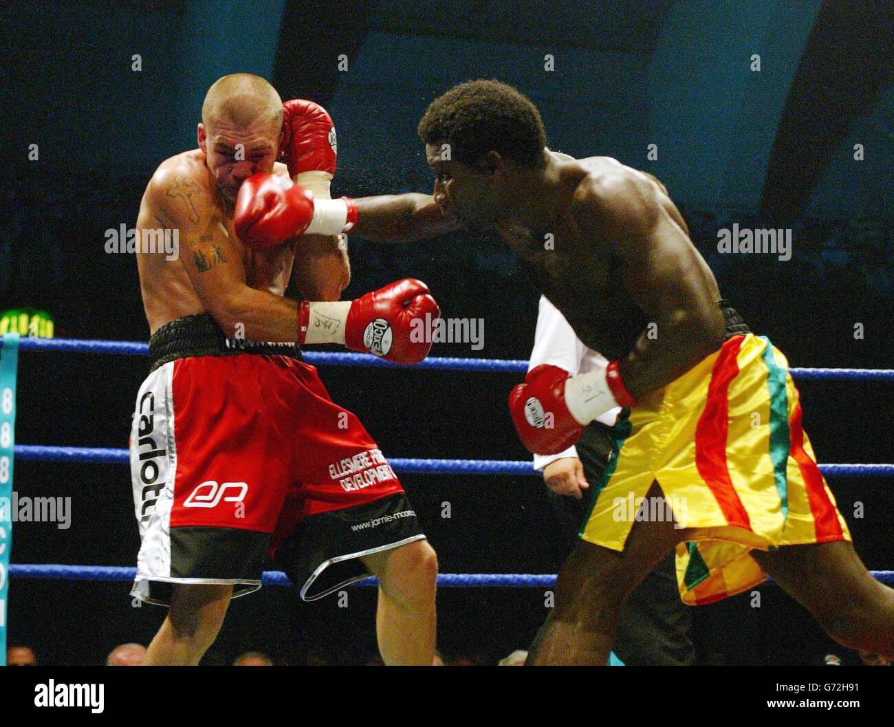 Jamie Moore (left) takes a punch from Ossie Duran during the ...