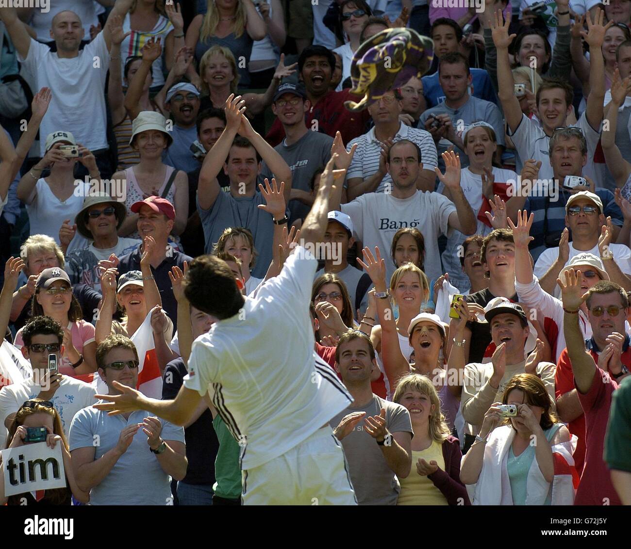 Great Britain's Tim Henman throws his towel into the crowd after his ...