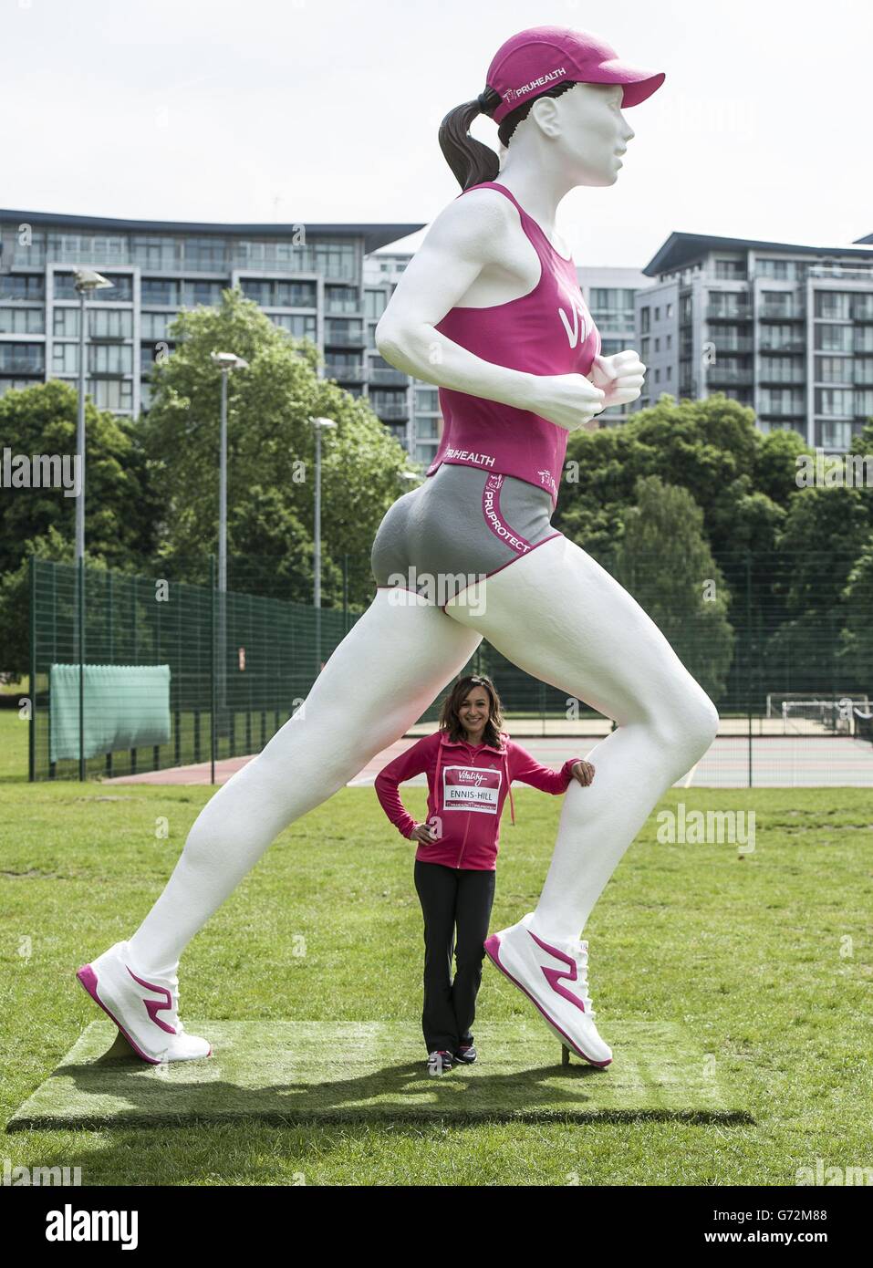 Jessica Ennis-Hill poses for a photograph with a statue of a giant ...