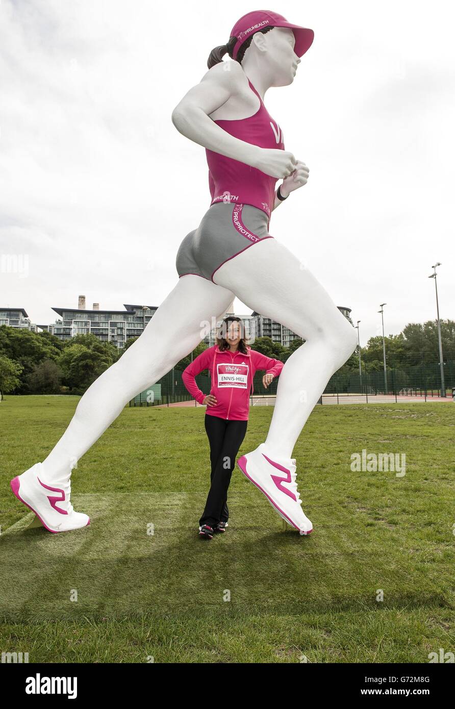 Jessica Ennis-Hill poses for a photograph with a statue of a giant ...
