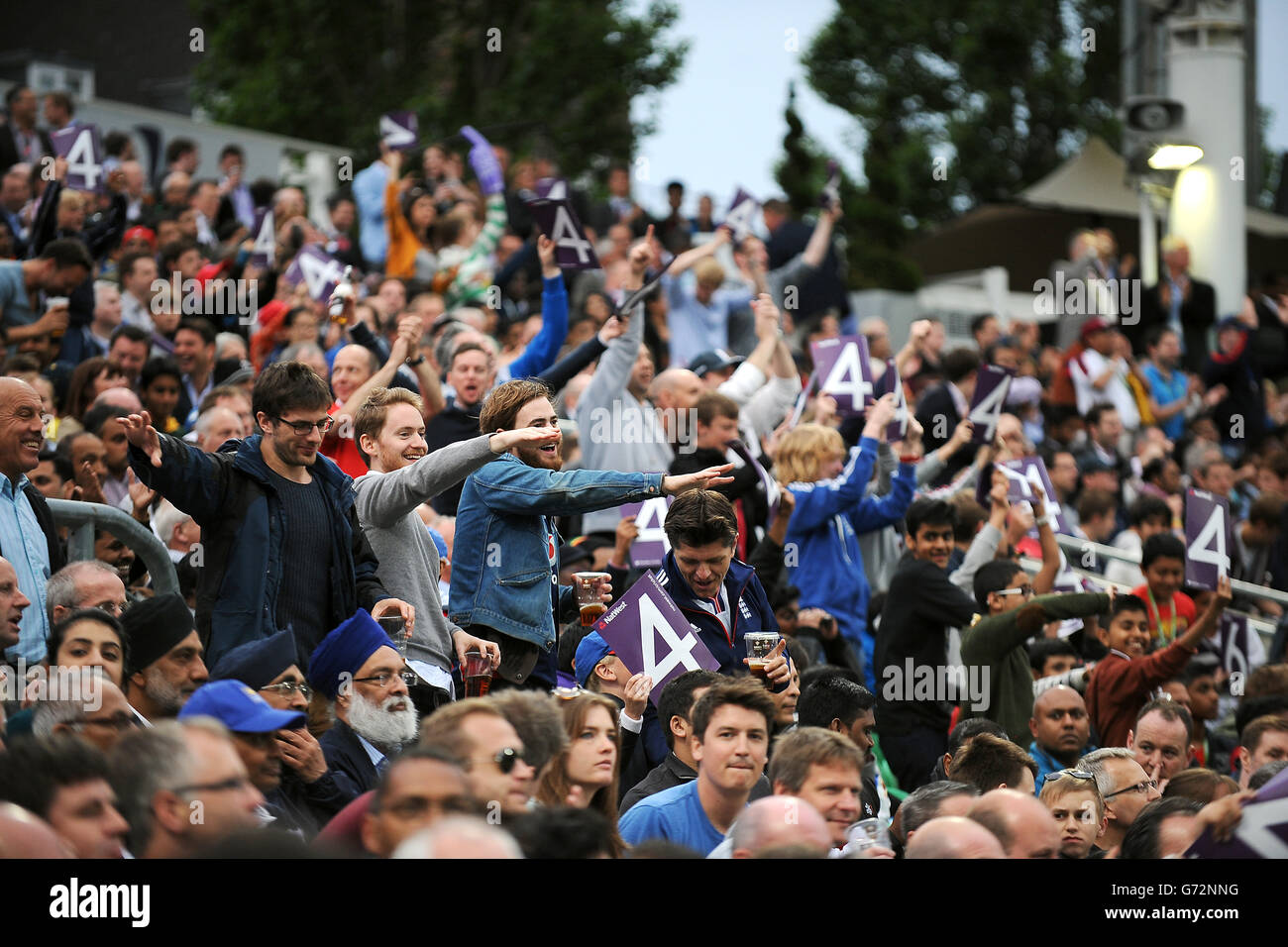 Spectators celebrate a four in the stands hi-res stock photography and ...
