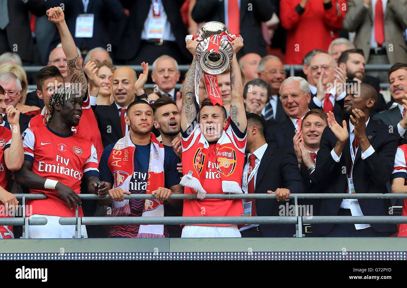 Arsenal's Jack Wilshere celebrates with the FA Cup trophy in the stands ...