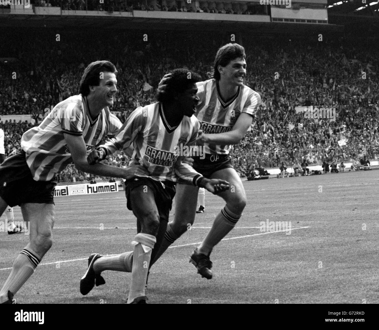 Coventry City's Dave Bennett (centre) is congratulated by teammates ...