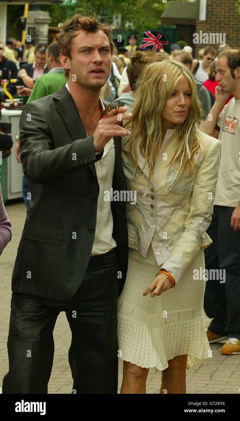 Actor Jude Law and his girlfriend Sienna Miller arrive at The Lawn ...