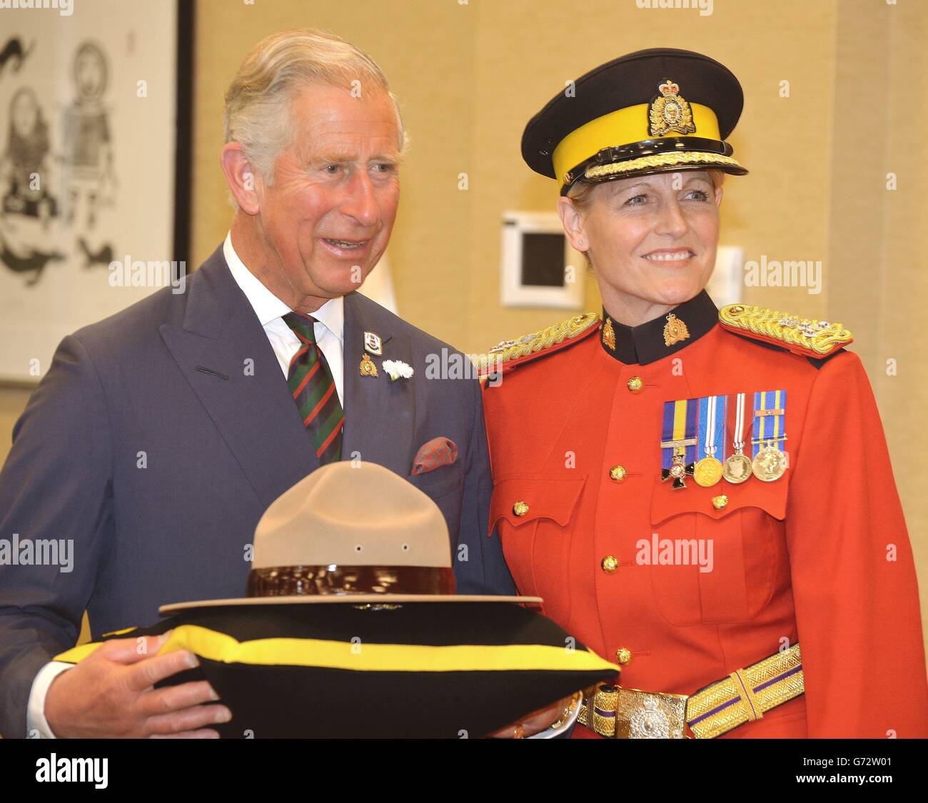 The Prince of Wales is presented with a Royal Canadian mounted Police ...