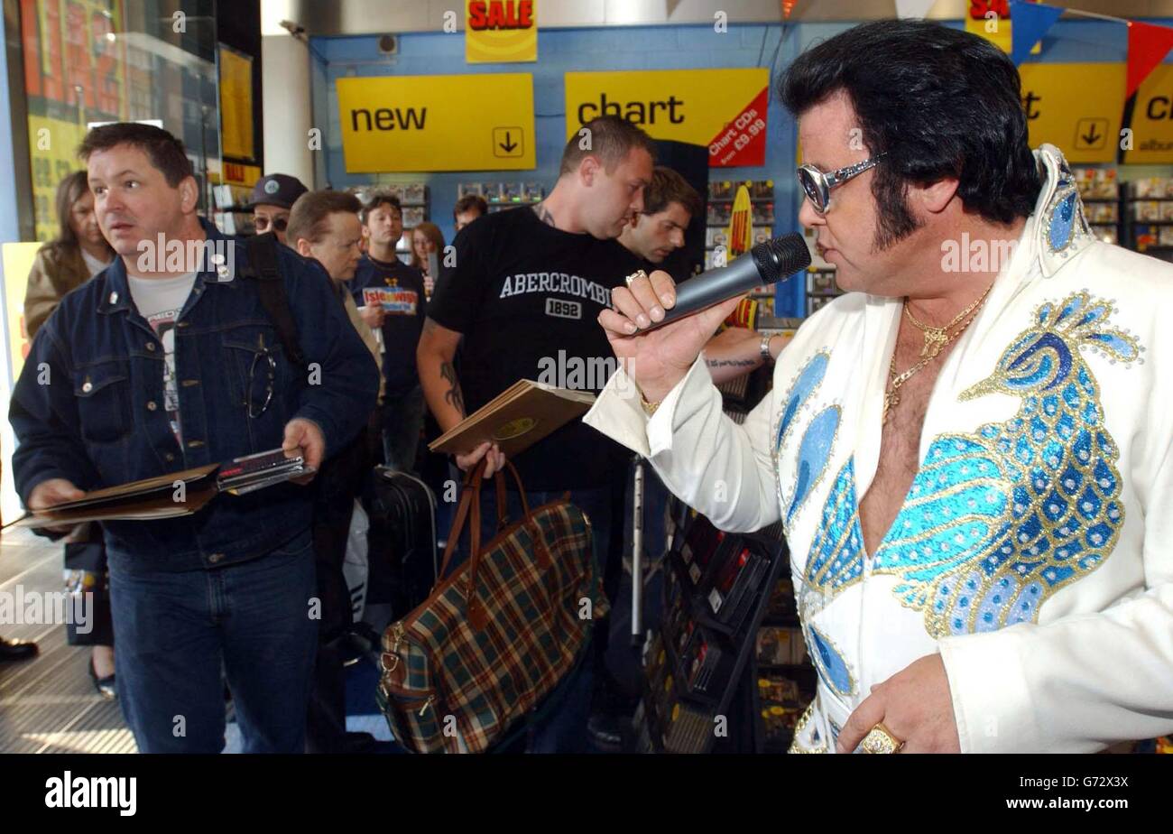 Elvis Impersonator Louis Rockefeller performs at HMV in London's Oxford ...