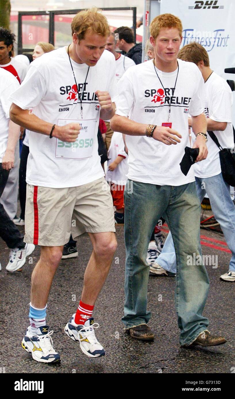 Prince William warms up while alongside his brother Prince Harry (right ...
