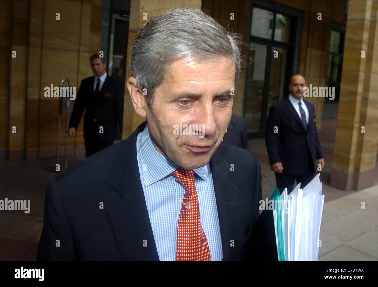 The chief executive Stuart Rose leaves Cabot Hall at Canary Wharf in ...