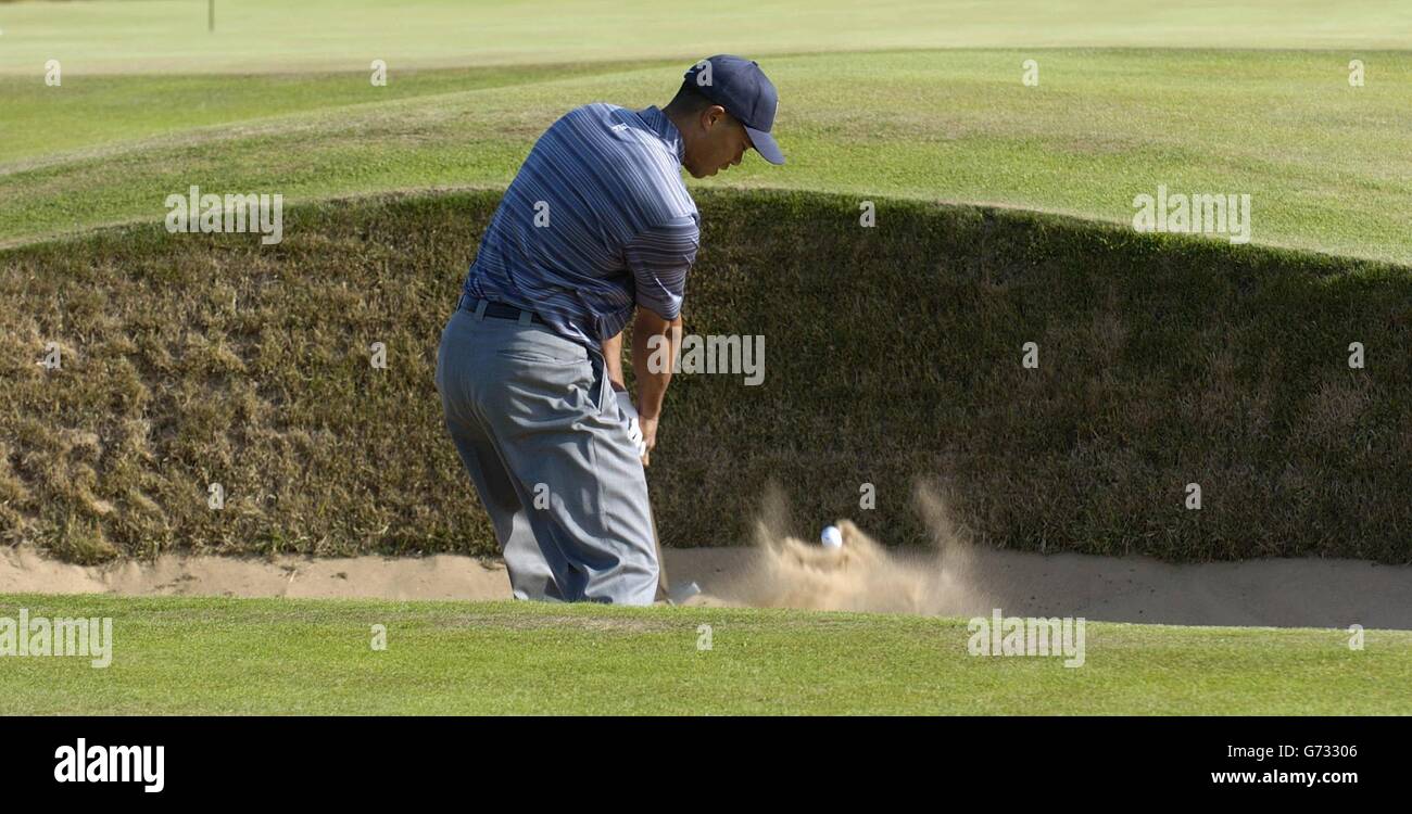 USA's Tiger Woods plays out of a greenside bunker during a practice ...