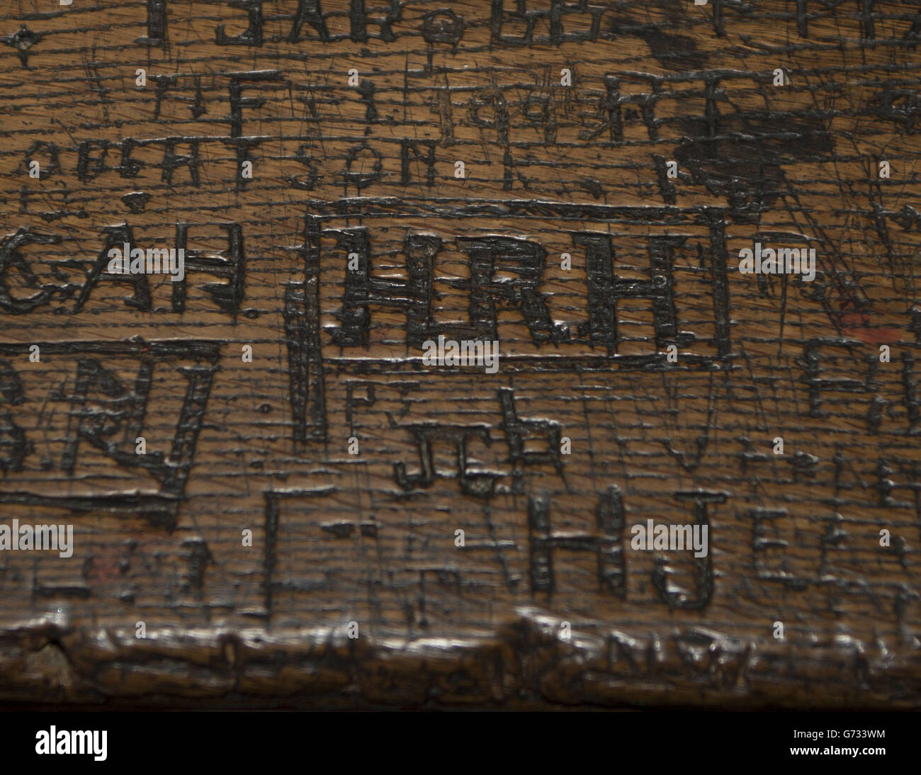 A desk in the classroom with 'HRH' engraved on it as The Prince of ...