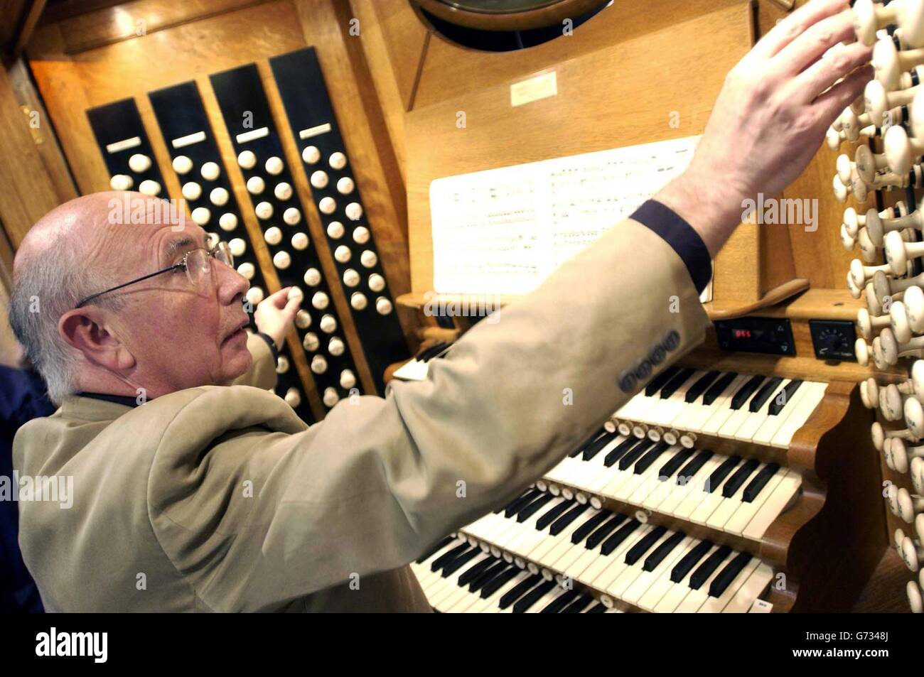 Acclaimed organist Martin Neary fine-tunes his performance on the newly ...