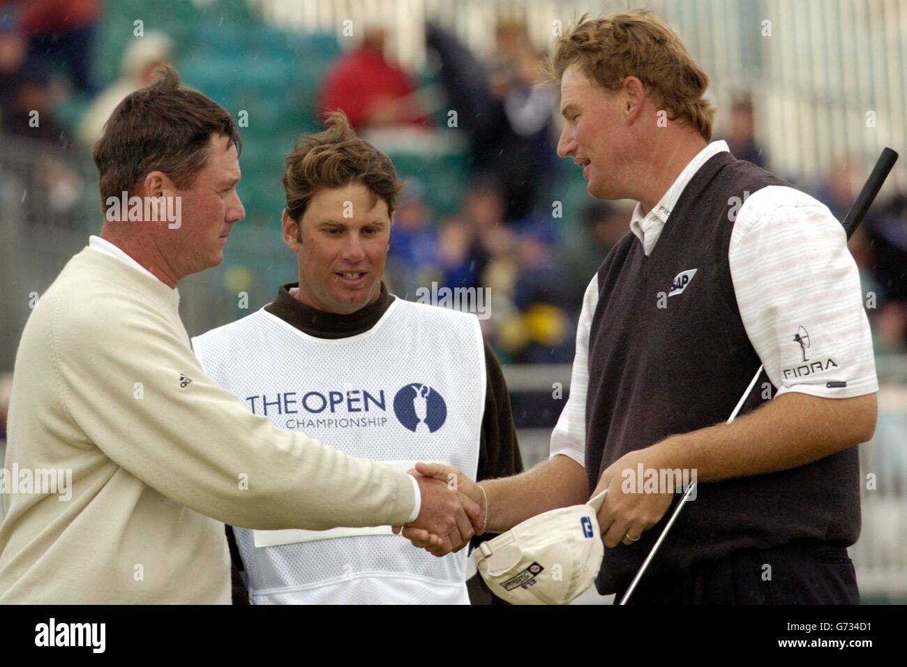 American Todd Hamilton (left) shakes hands with South African Ernie Els ...