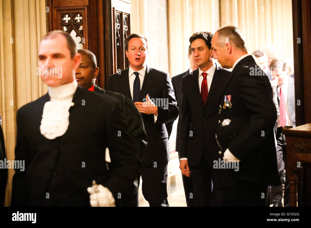 Prime Minister David Cameron and Labour leader Ed Miliband walk through ...