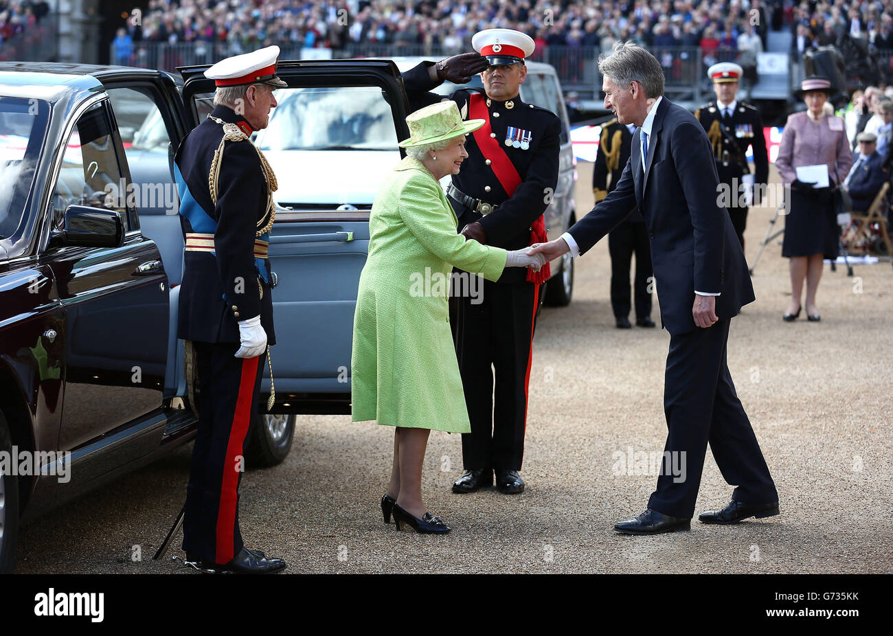 Queen Elizabeth II is greeted by Defence Secretary Philip Hammond ...