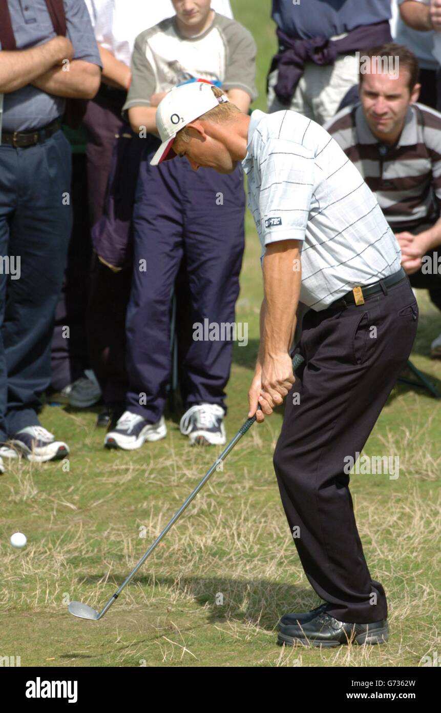 Ireland's Padraig Harrington chips onto the fifth green, in the first ...