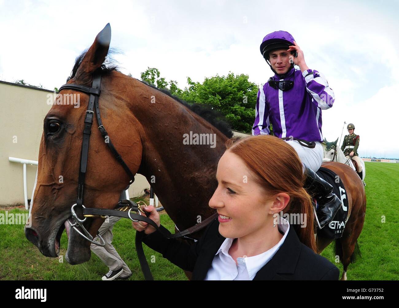 Marvellous and jockey Ryan Moore are led by groom Maria Quinlan after ...