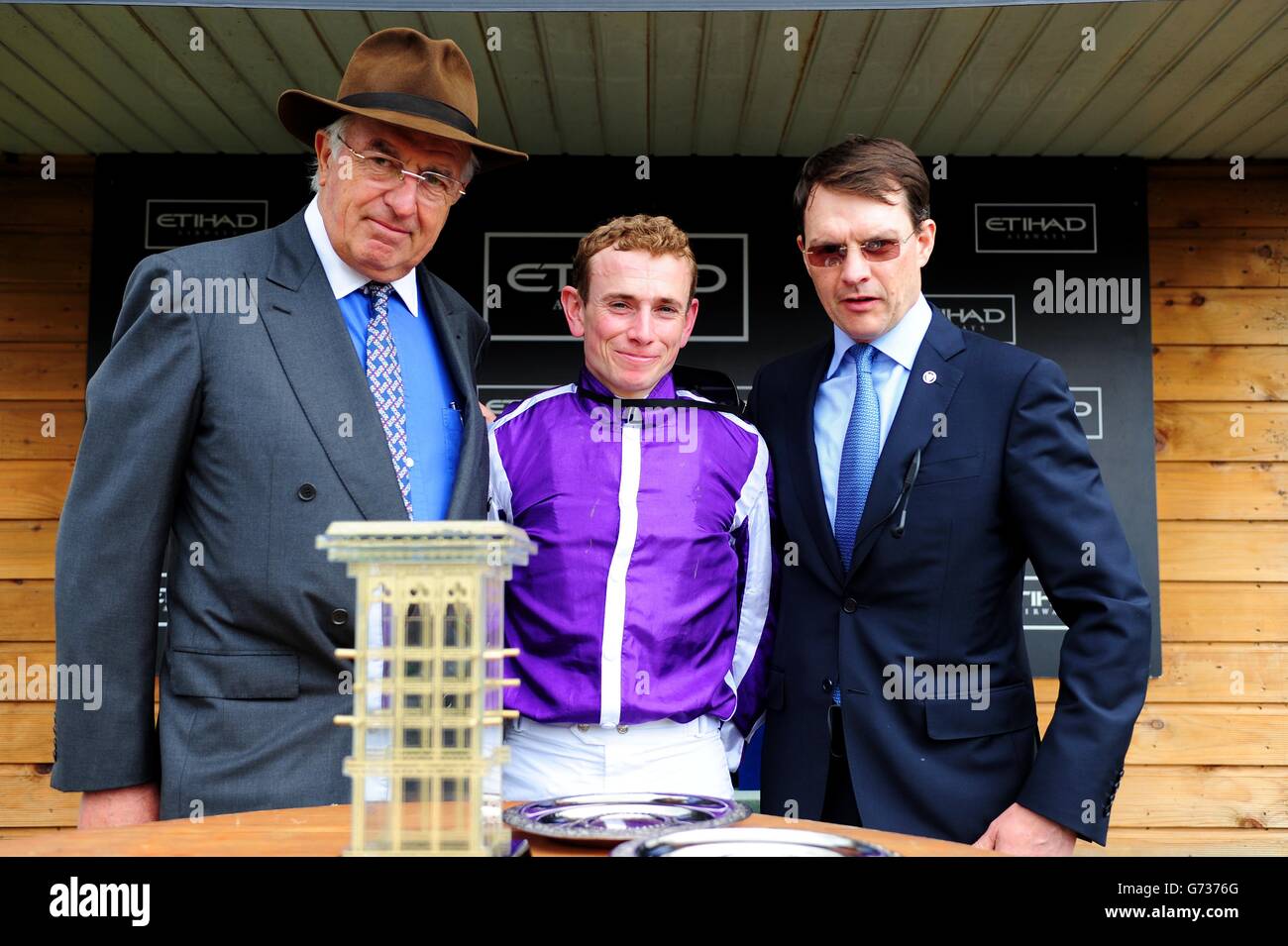Jockey Ryan Moore, trainer Aidan O'Brien (right) and Owner John Magnier ...