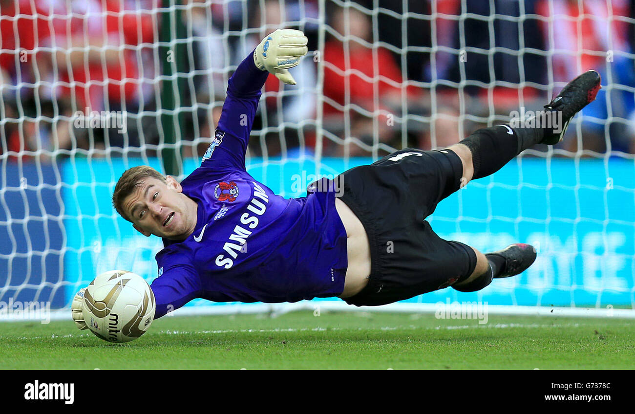 Leyton Orient goalkeeper Jamie Jones saves a penalty from Rotherham ...