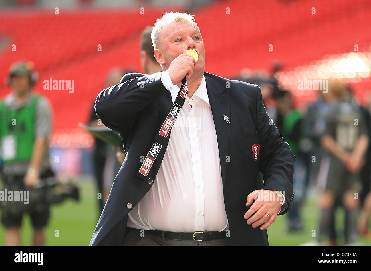Rotherham United manager Steve Evans celebrates with his winner's medal ...