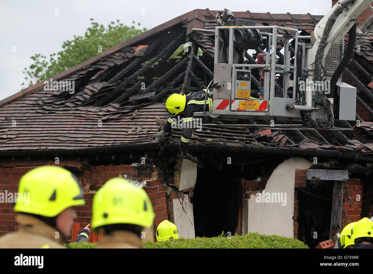 Fire crews secure the scene after an explosion at a bungalow in The ...