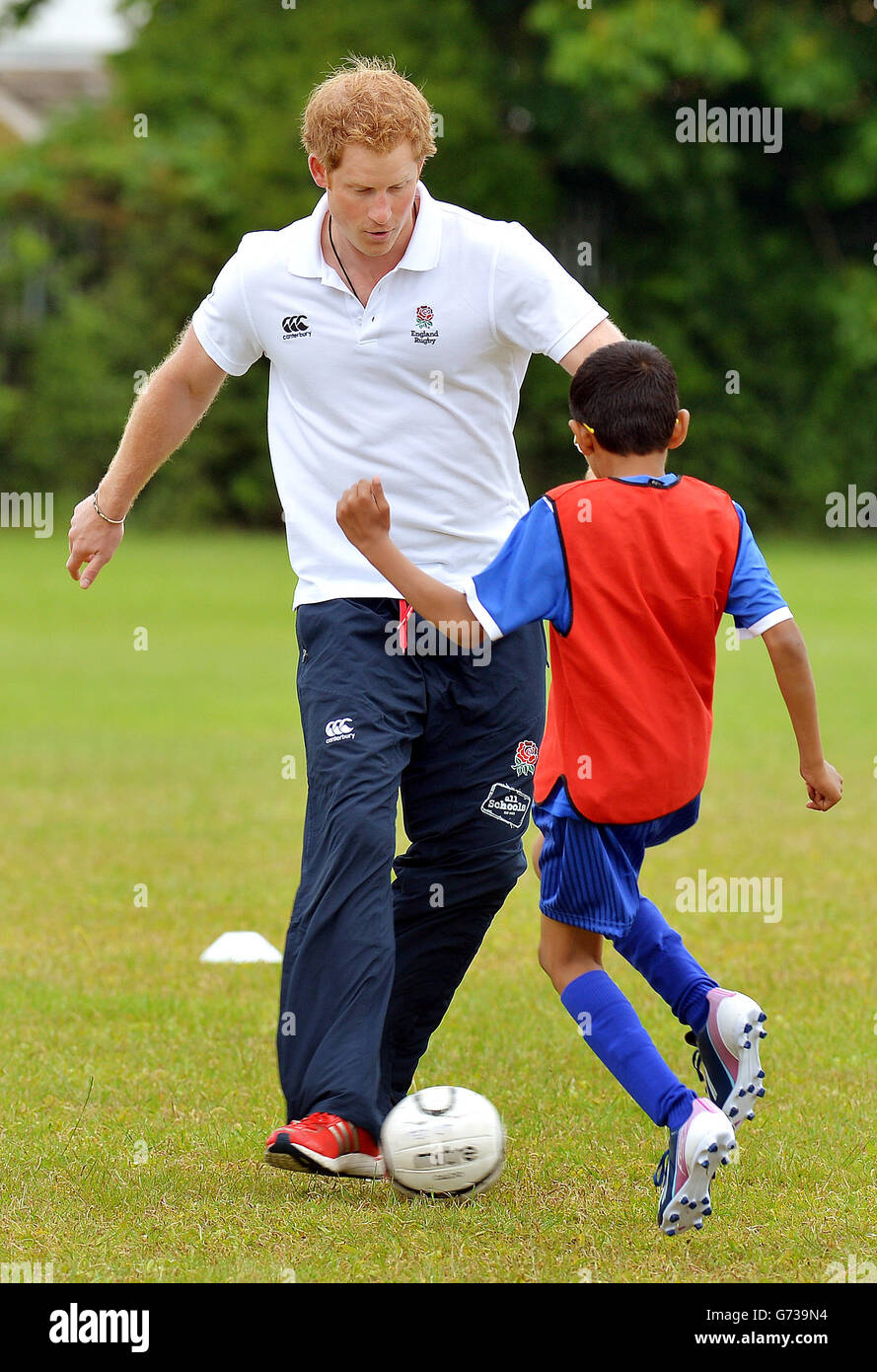 Prince Harry shows off his football prowess, during a kick about with ...