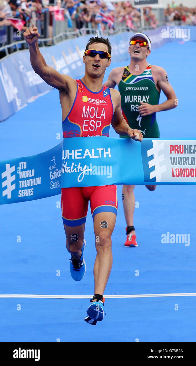 Spain's Mario Mola crosses the finish line to win the Mens Elite Race ...