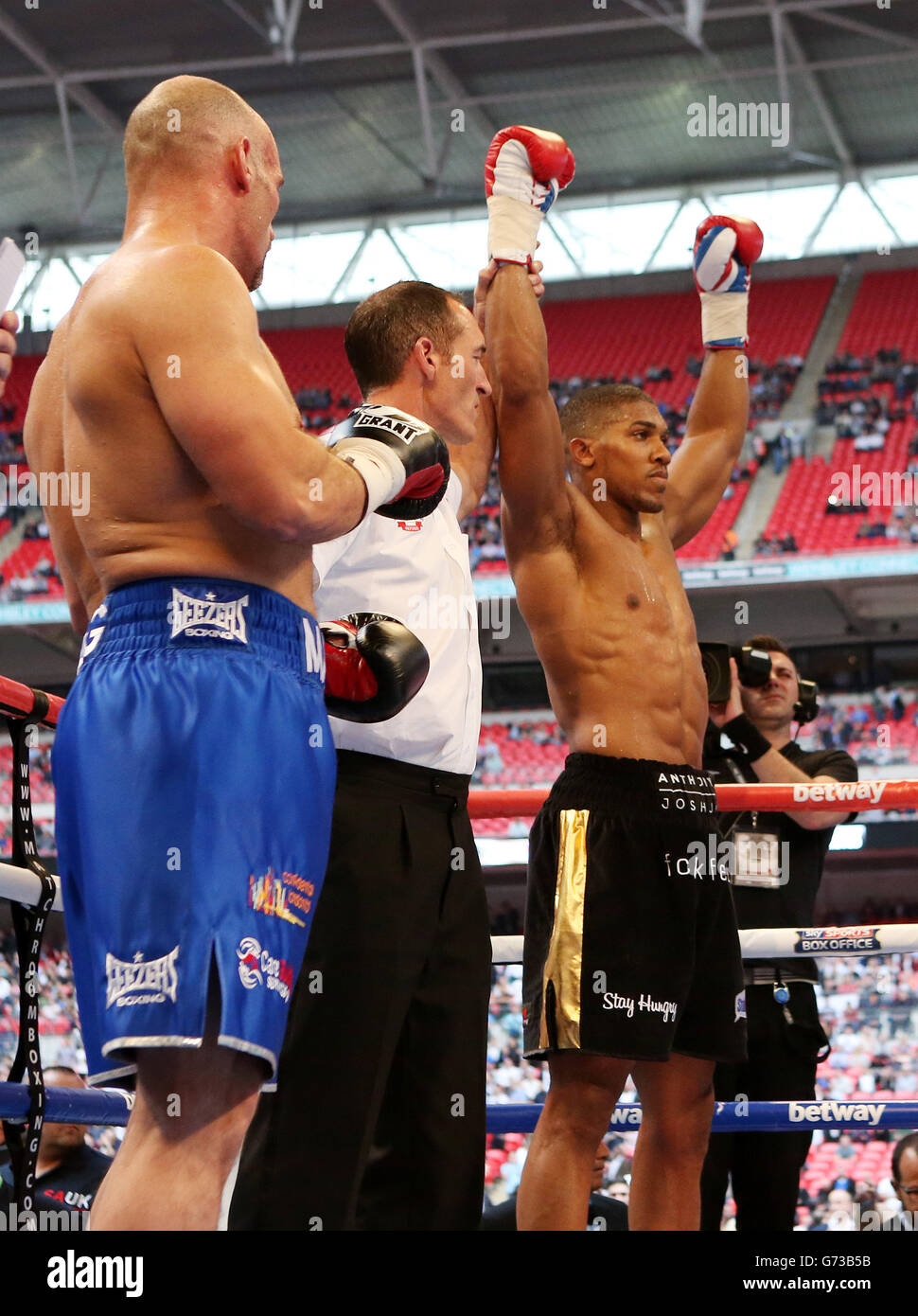 Boxing - Undercard - Wembley Arena. Anthony Joshua (right) celebrates ...