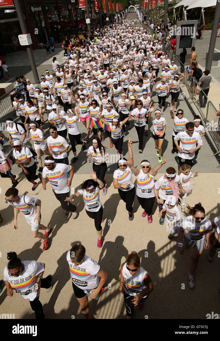 Runners take part in The Color Run in Wembley, London, a 5k run where ...