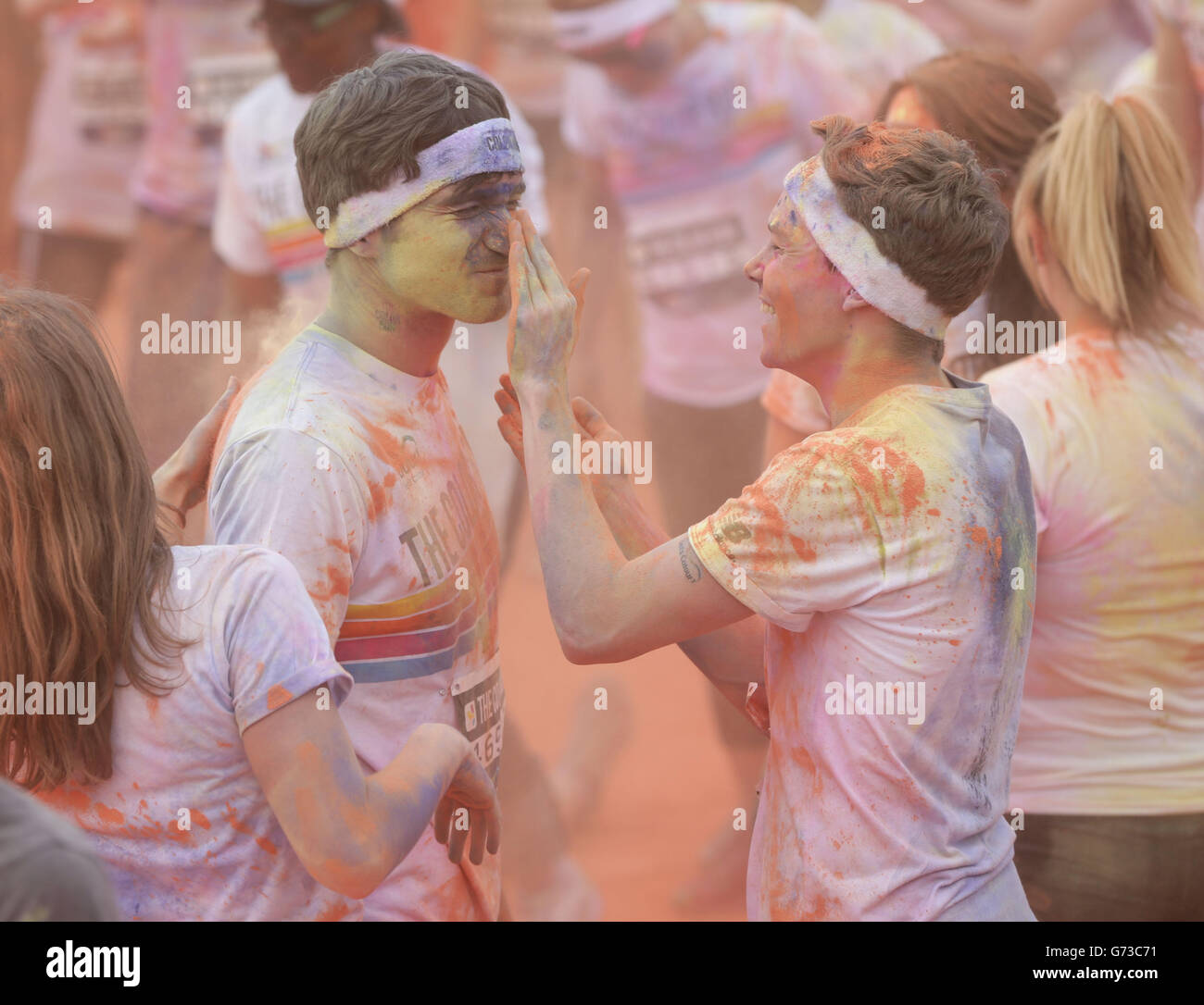 Runners cross the finish line at The Color Run in Wembley, London, a 5k ...