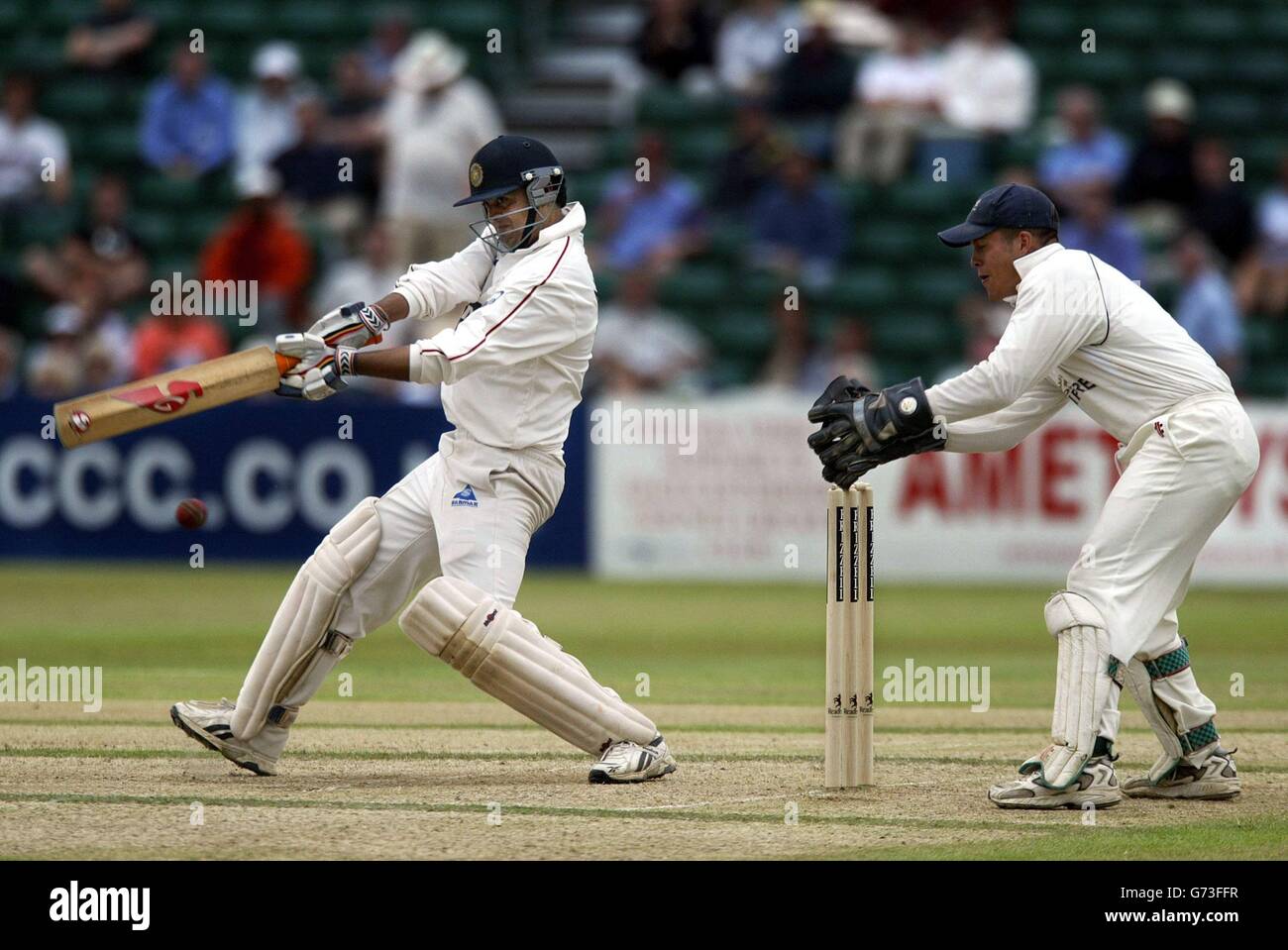 Lancashire batsman Dinesh Mongil adds to his score by cutting a ...