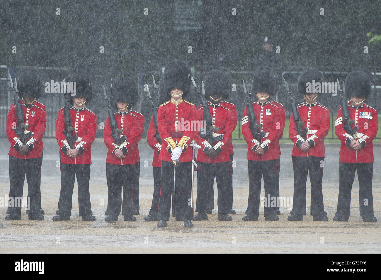 Grenadier guards stand in the rain during the colonels review hi-res ...