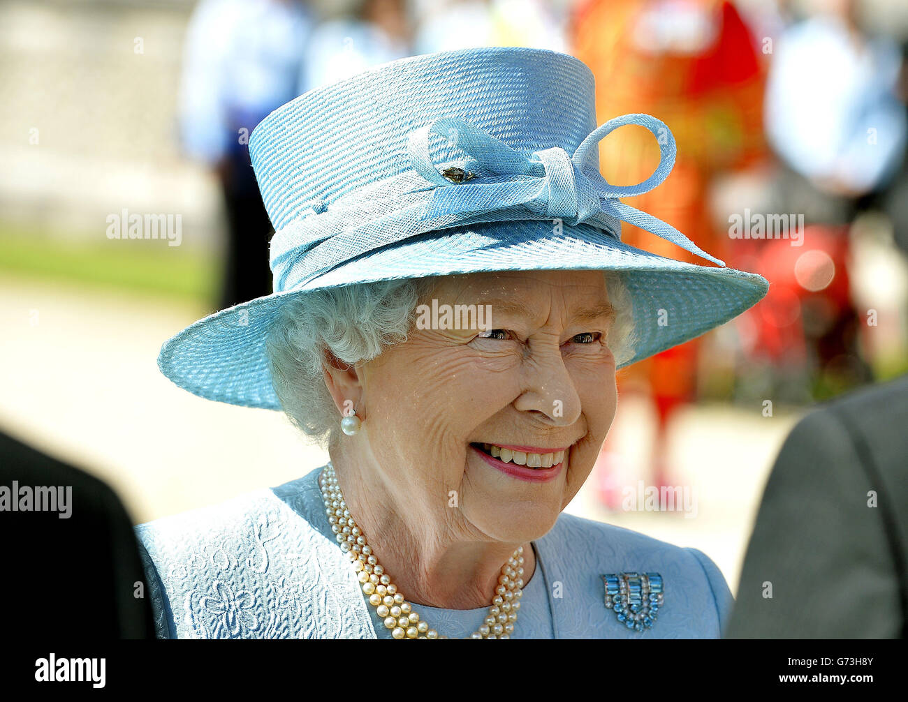 Queen Elizabeth II meets guests during a garden party held at ...