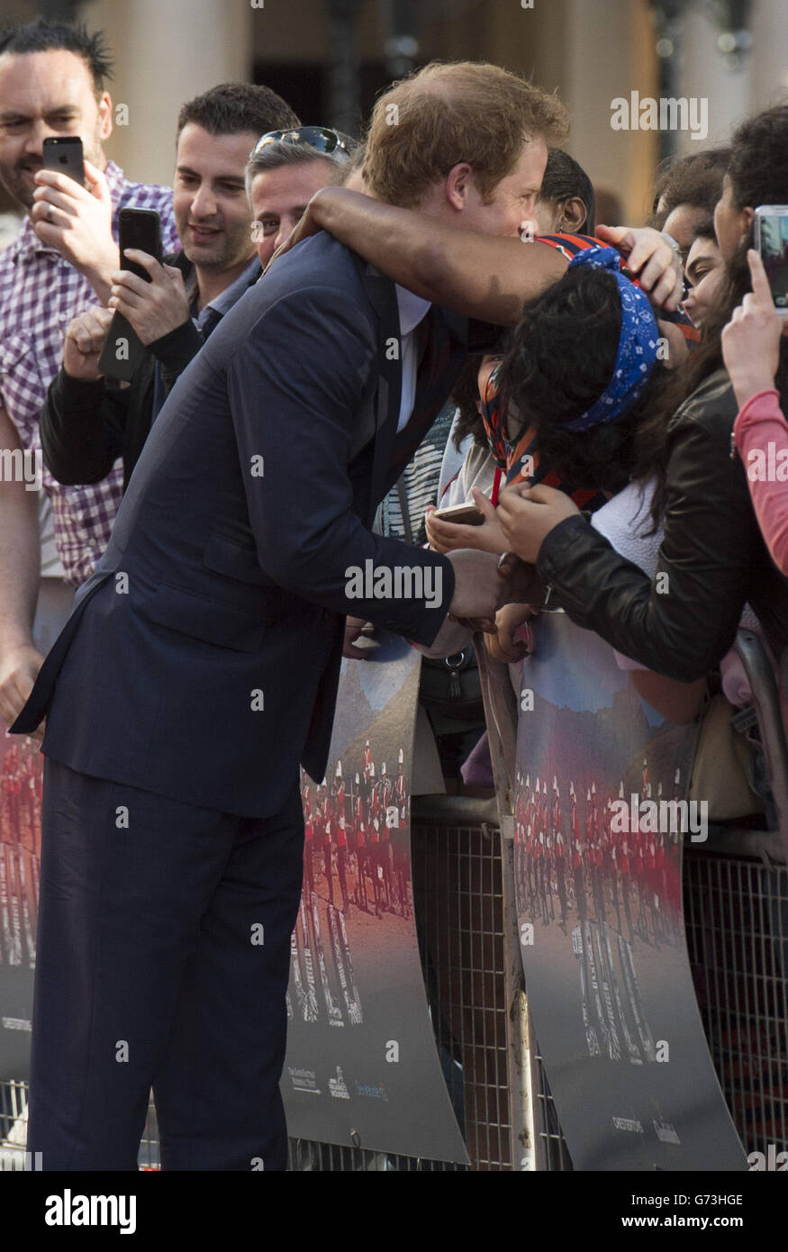 Prince Harry receives a hug from a fan as he attends the 50th ...