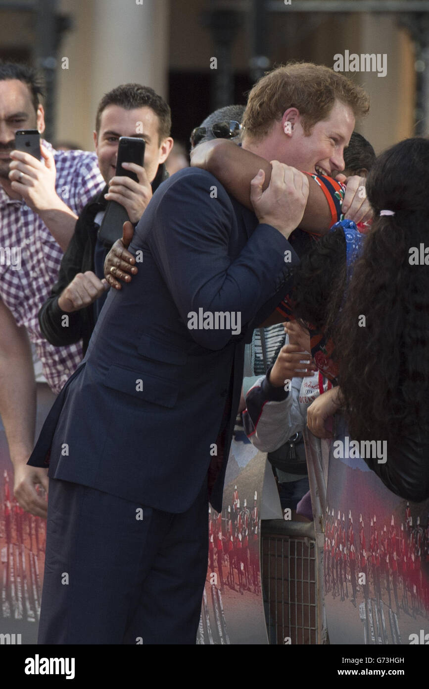 Prince Harry receives a hug from a fan as he attends the 50th ...
