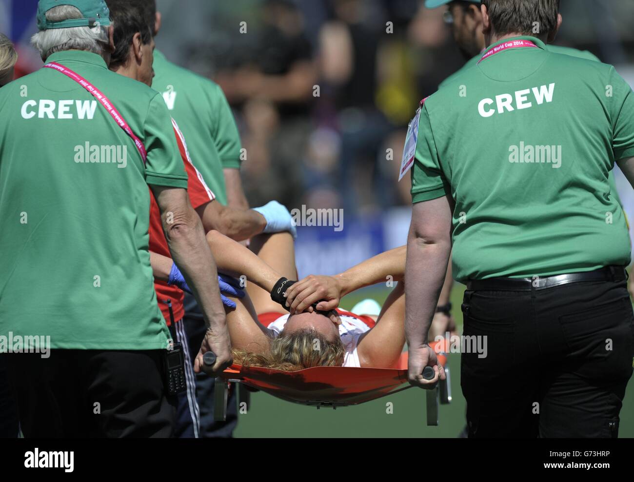 England's Ashley Ball is carried off after suffering a knee injury ...