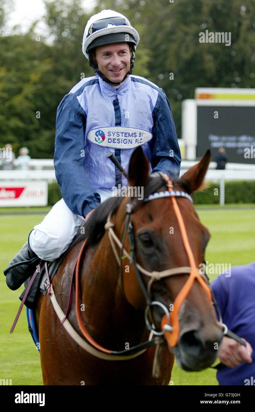 Jockey Richard Quinn enters the winners' enclosure on Ringmoor Down ...