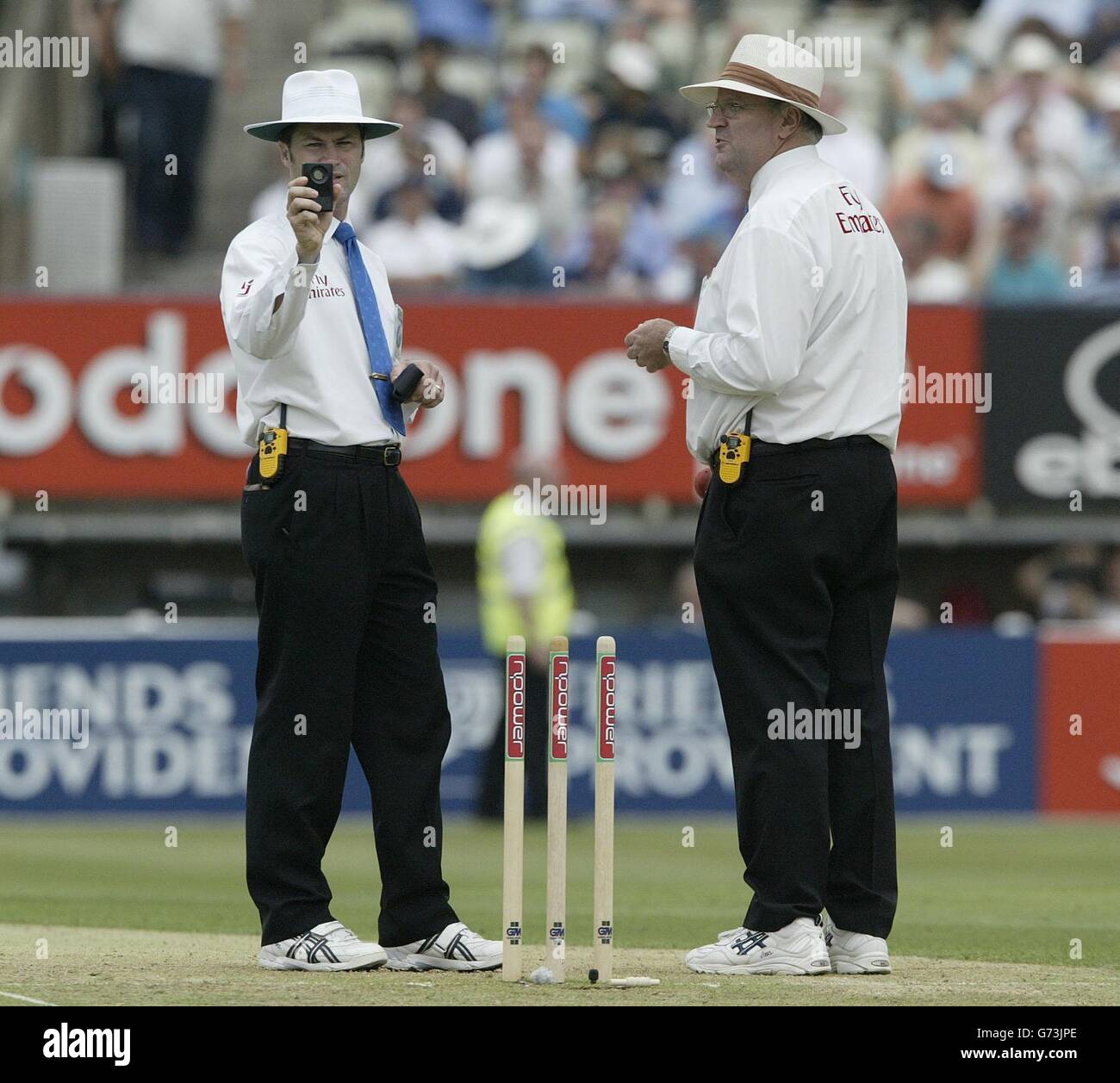 Umpire's Simon Taufel and Darrell Hair (right) use their light meter in ...