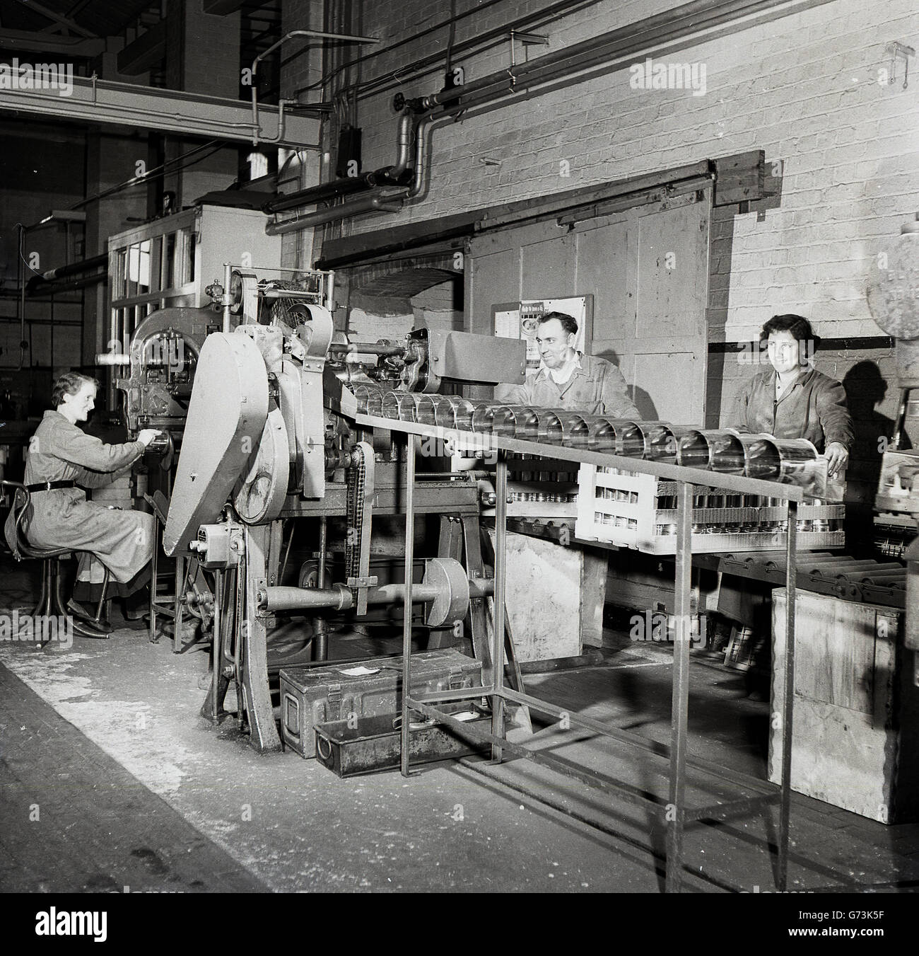 1950s, historical, factory work in post-war Britain. Male & females ...