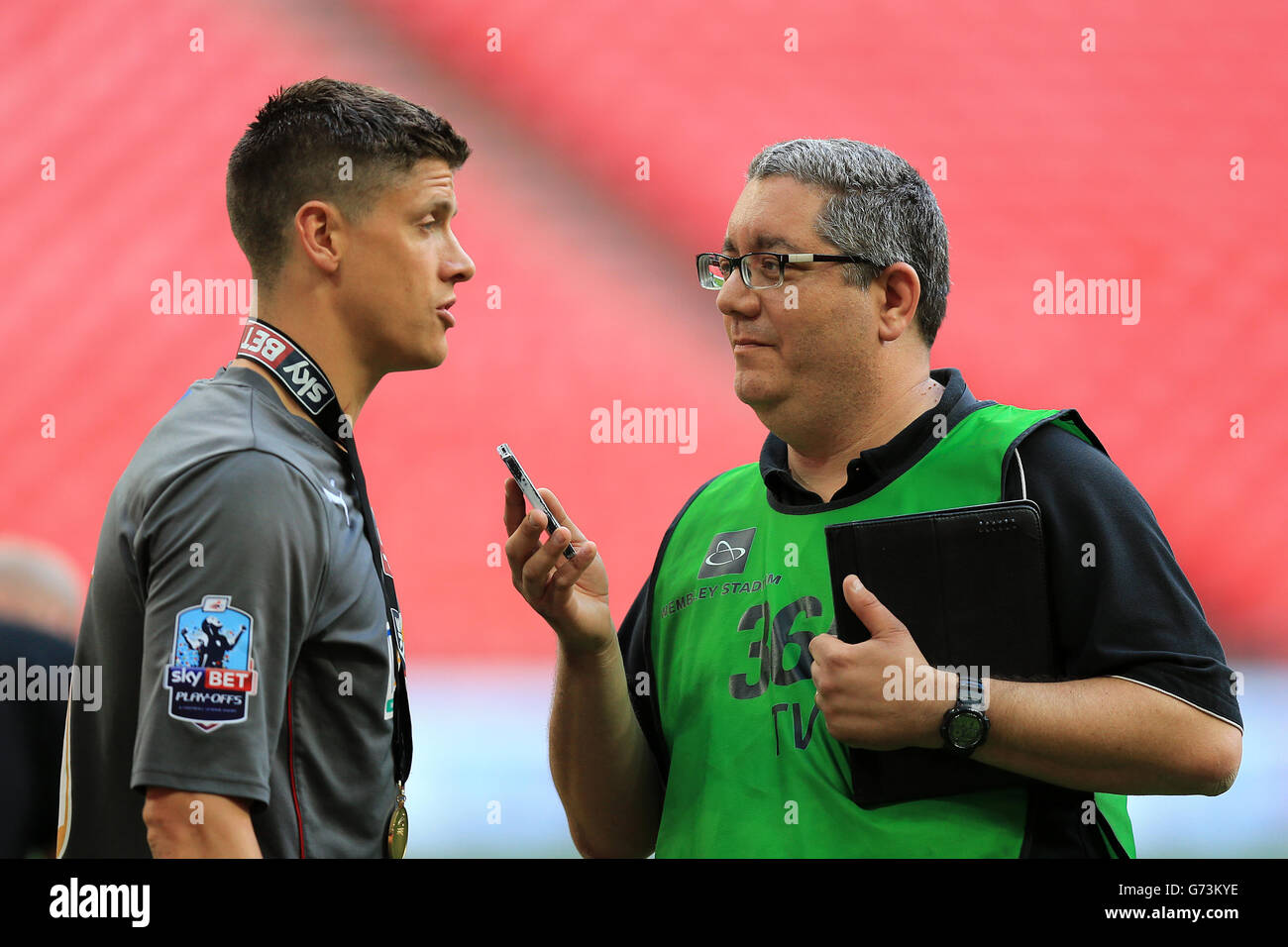 Mark Bradley, Rotherham United, speaks to a Talksport presenter Ian ...