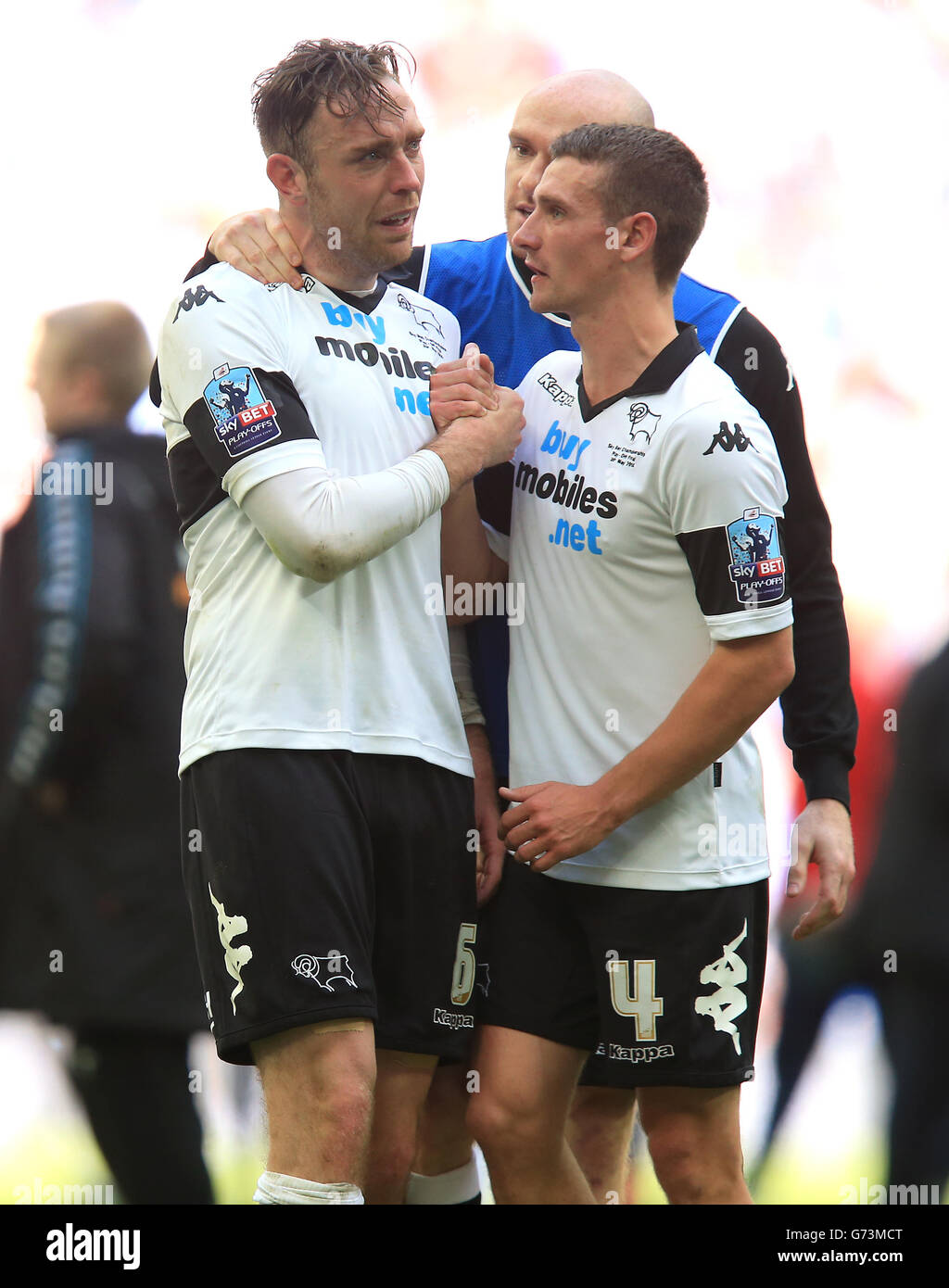 Derby countys richard keogh left is consoled by craig bryson hi-res ...
