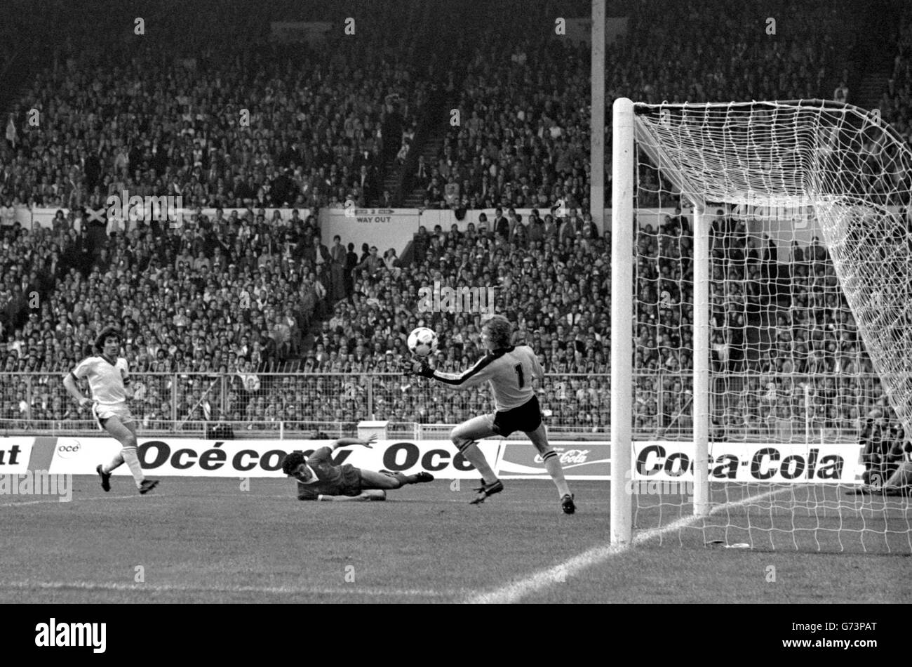 Bruges keeper Jensen makes a one-handed save from Liverpool's Alan ...