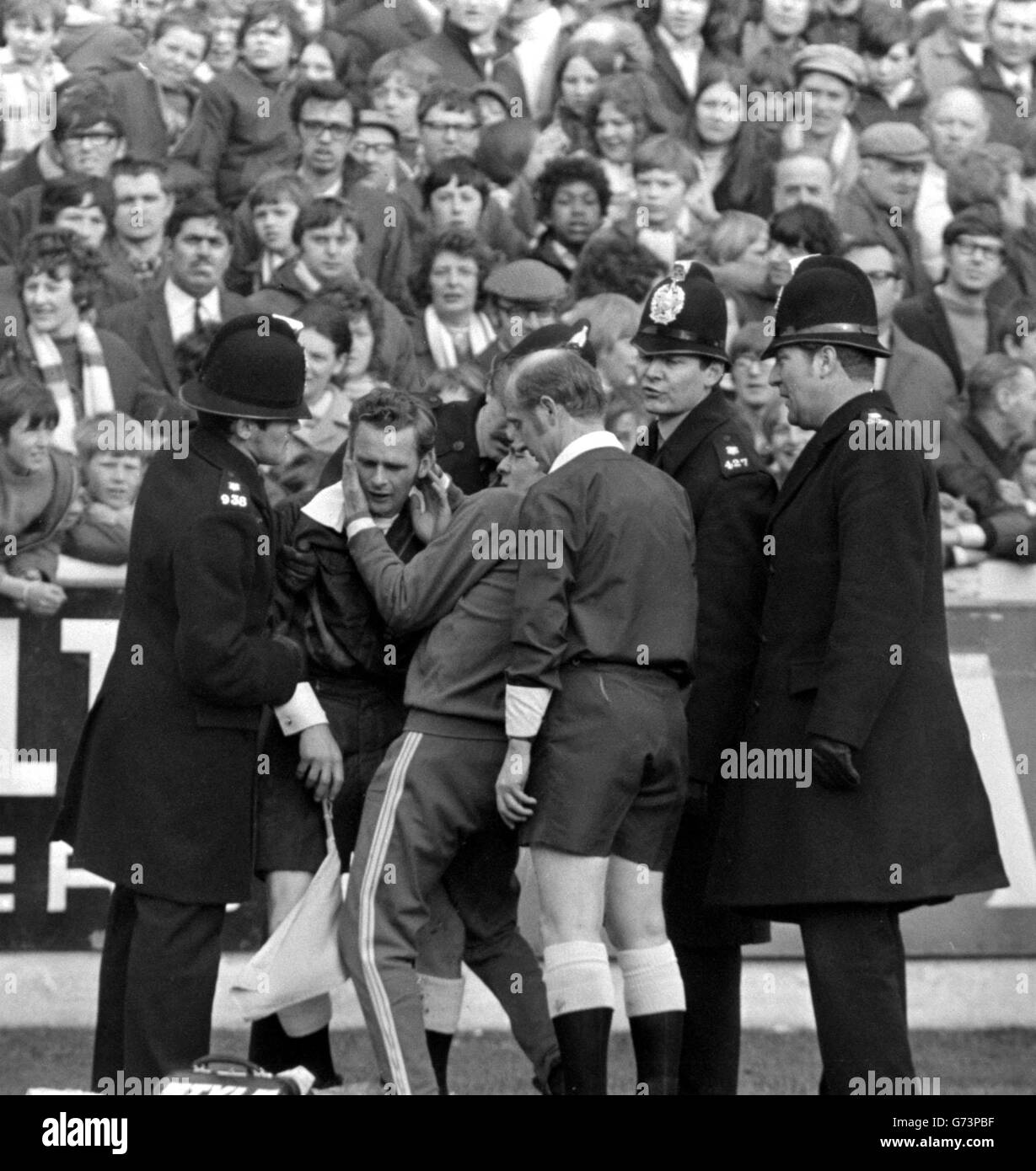 Injured linesman Colin Carthlich of Hull, receives attention from Leeds ...