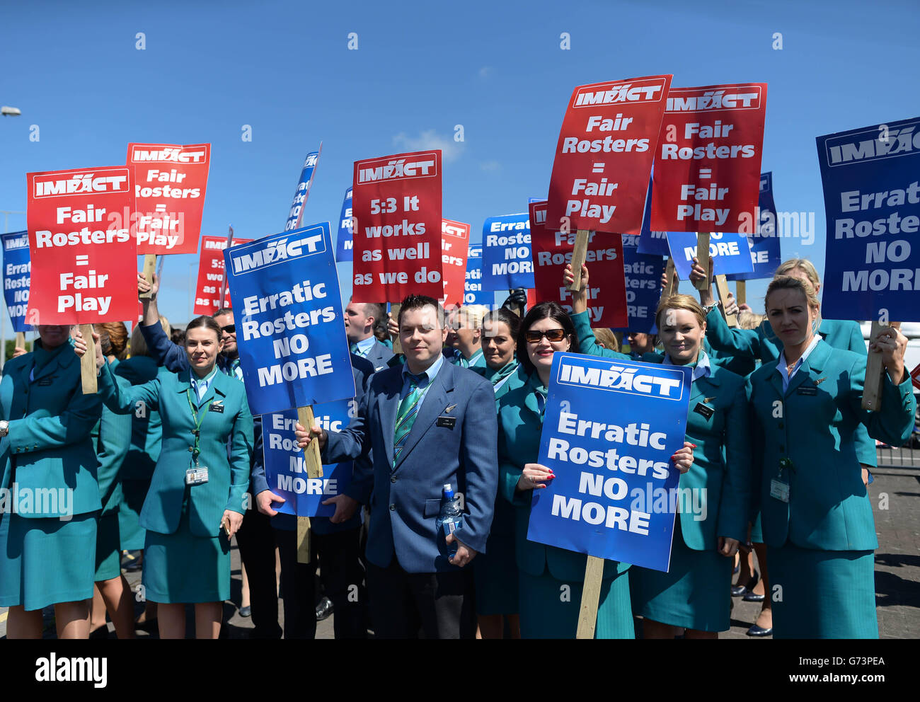 Aer Lingus staff at the entrance to Dublin Airport as 200 flights have ...
